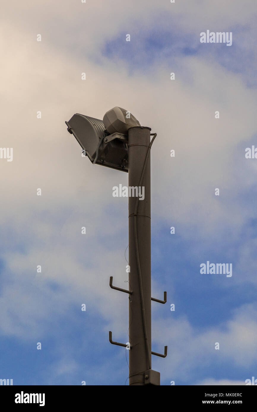 Searchlight on blue sky background Stock Photo - Alamy