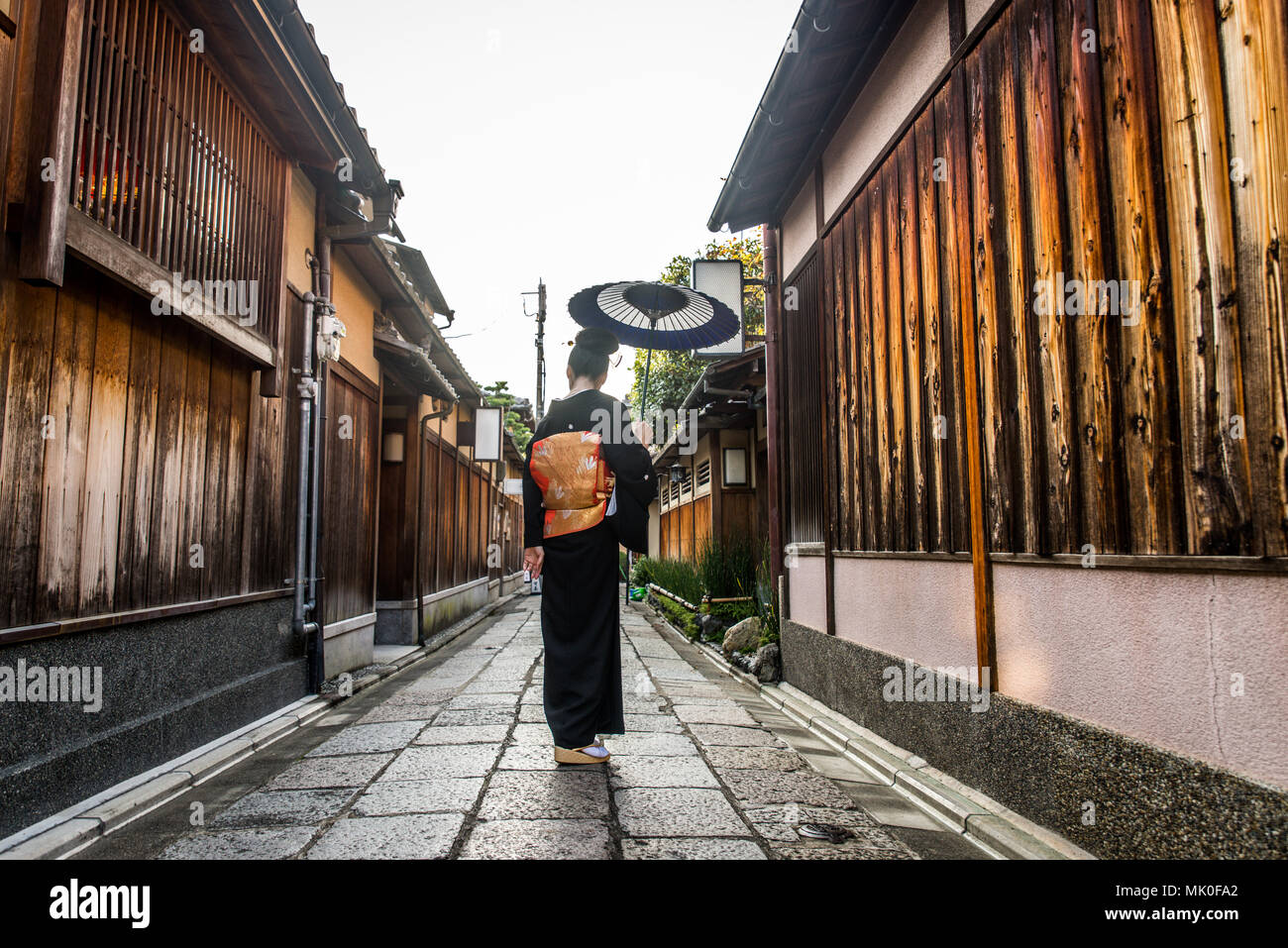 Japanese woman wearing traditional dress and walking outdoors Stock ...
