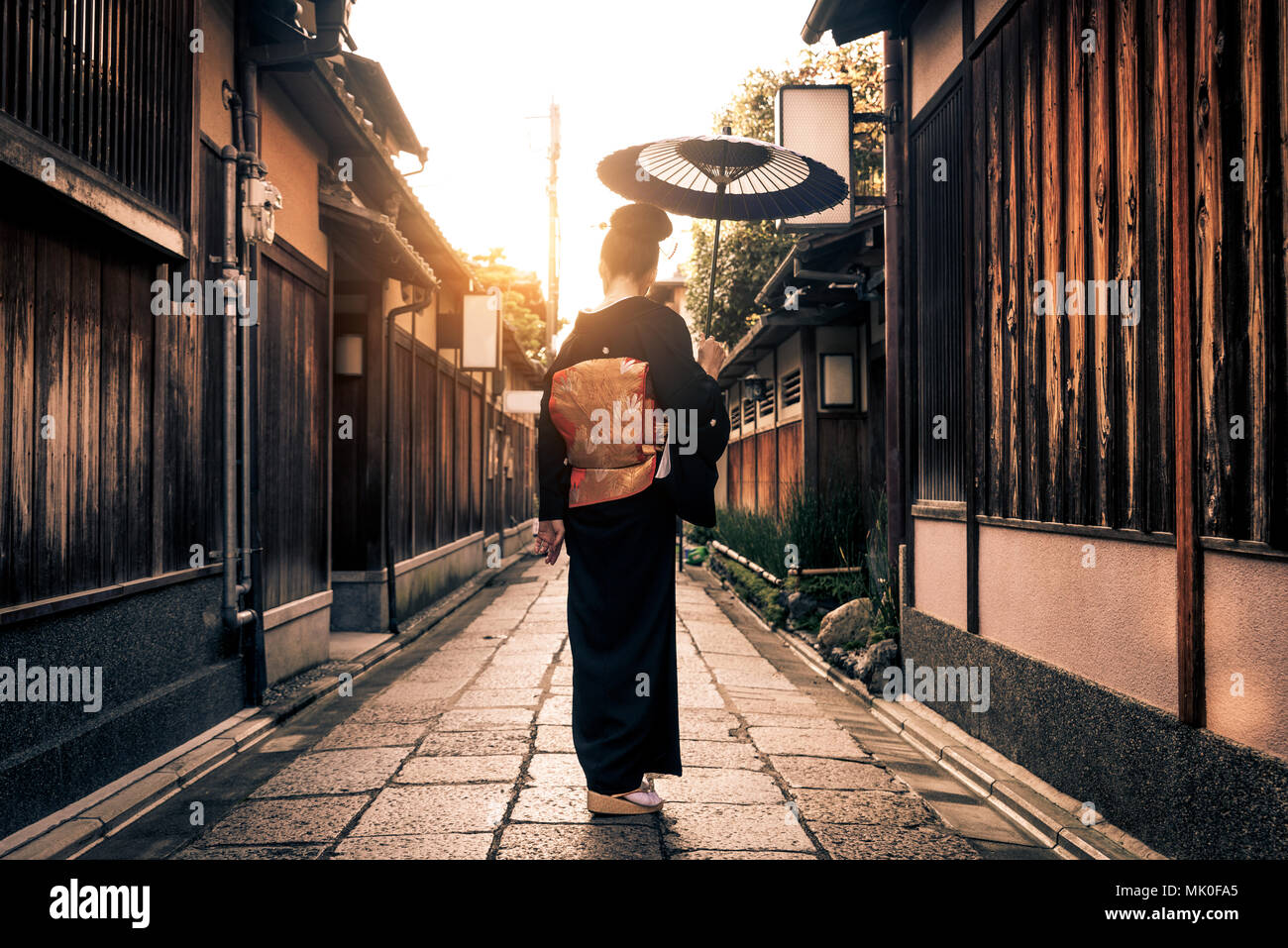 Japanese woman wearing traditional dress and walking outdoors Stock ...