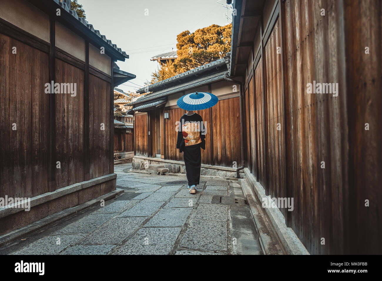 Japanese woman wearing traditional dress and walking outdoors Stock ...