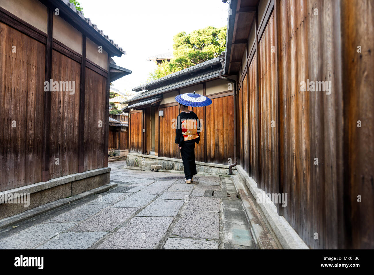 Japanese woman wearing traditional dress and walking outdoors Stock ...
