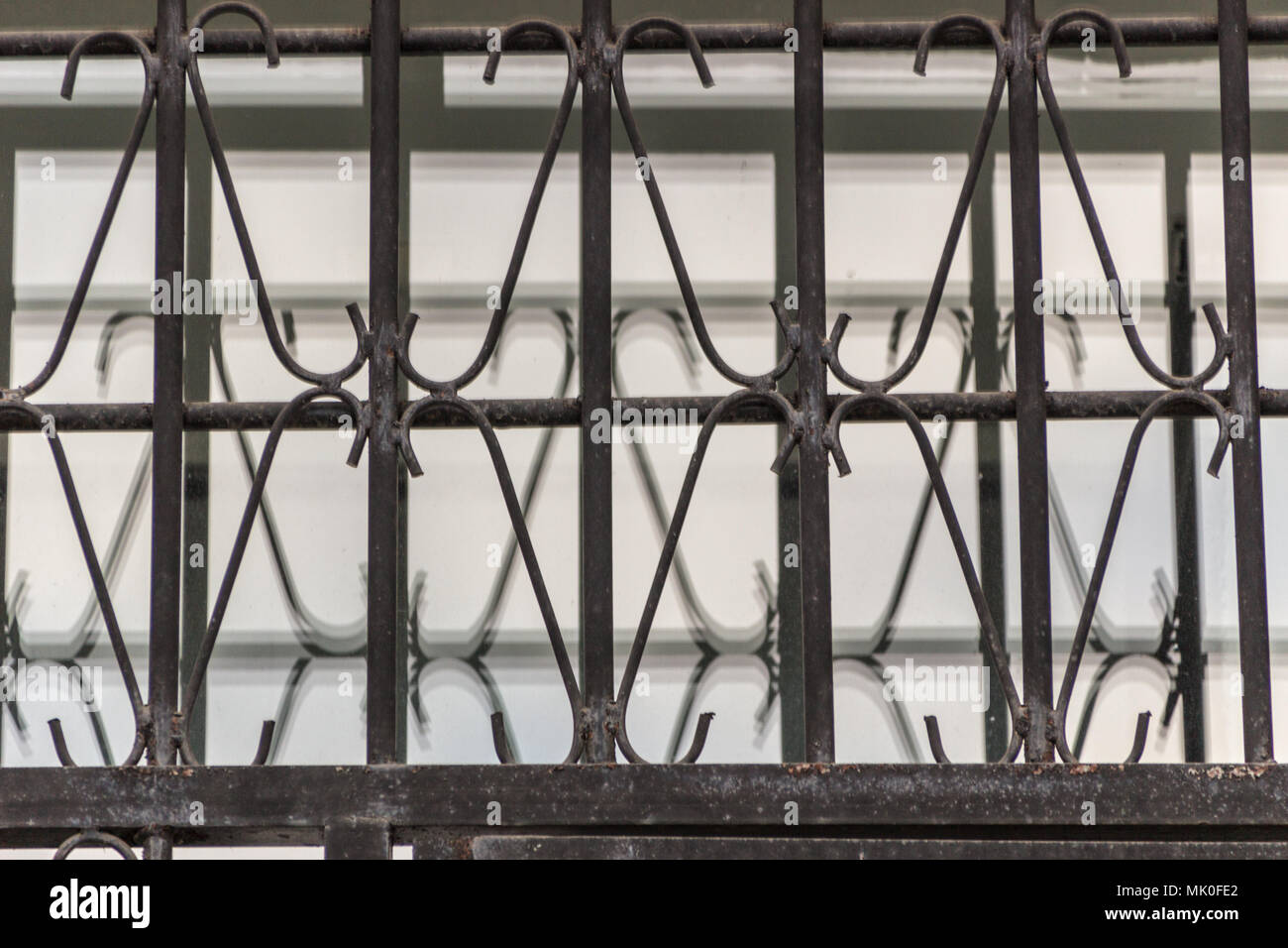 Window with wrought-iron grating, building facade Stock Photo - Alamy