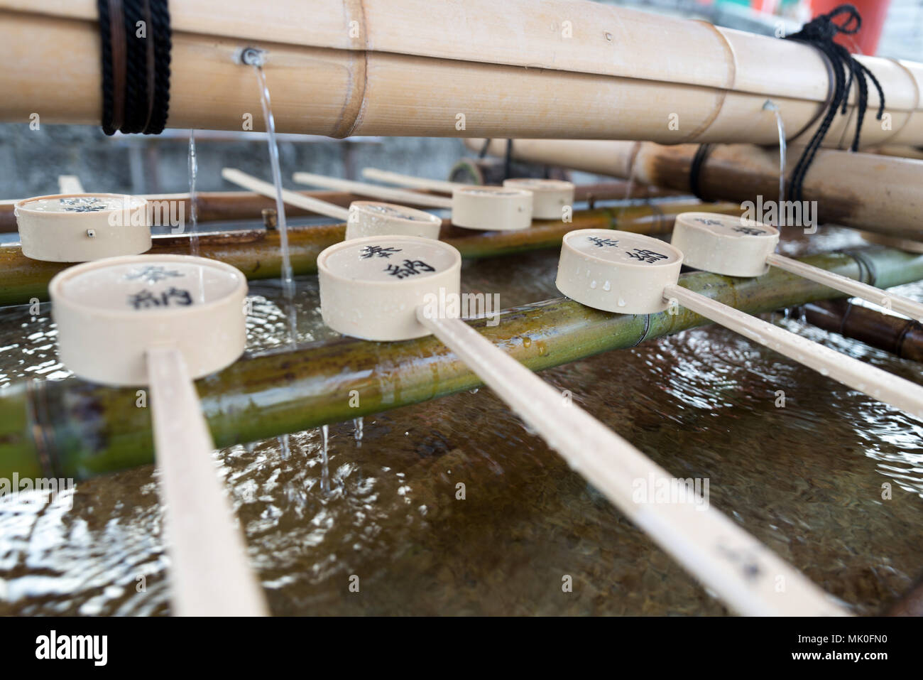 Japanese wooden ladle in shrine Stock Photo - Alamy