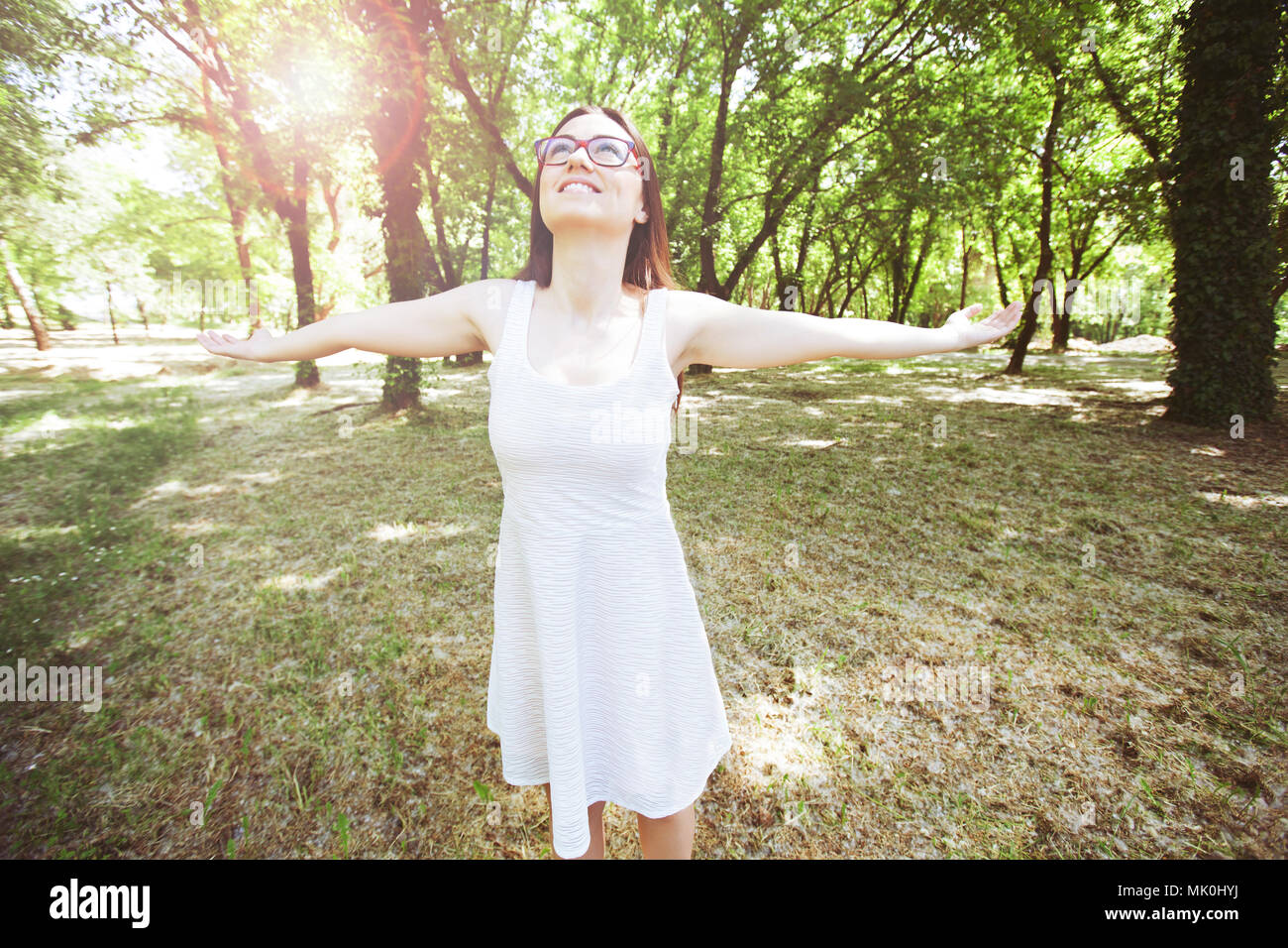 Carefree Beautiful Young Woman with eyeglasses enjoying nature, free ...