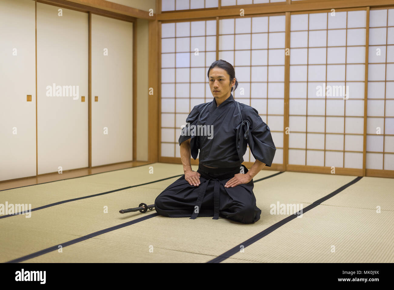 Japanese martial arts athlete training kendo in a dojo - Samaurai ...