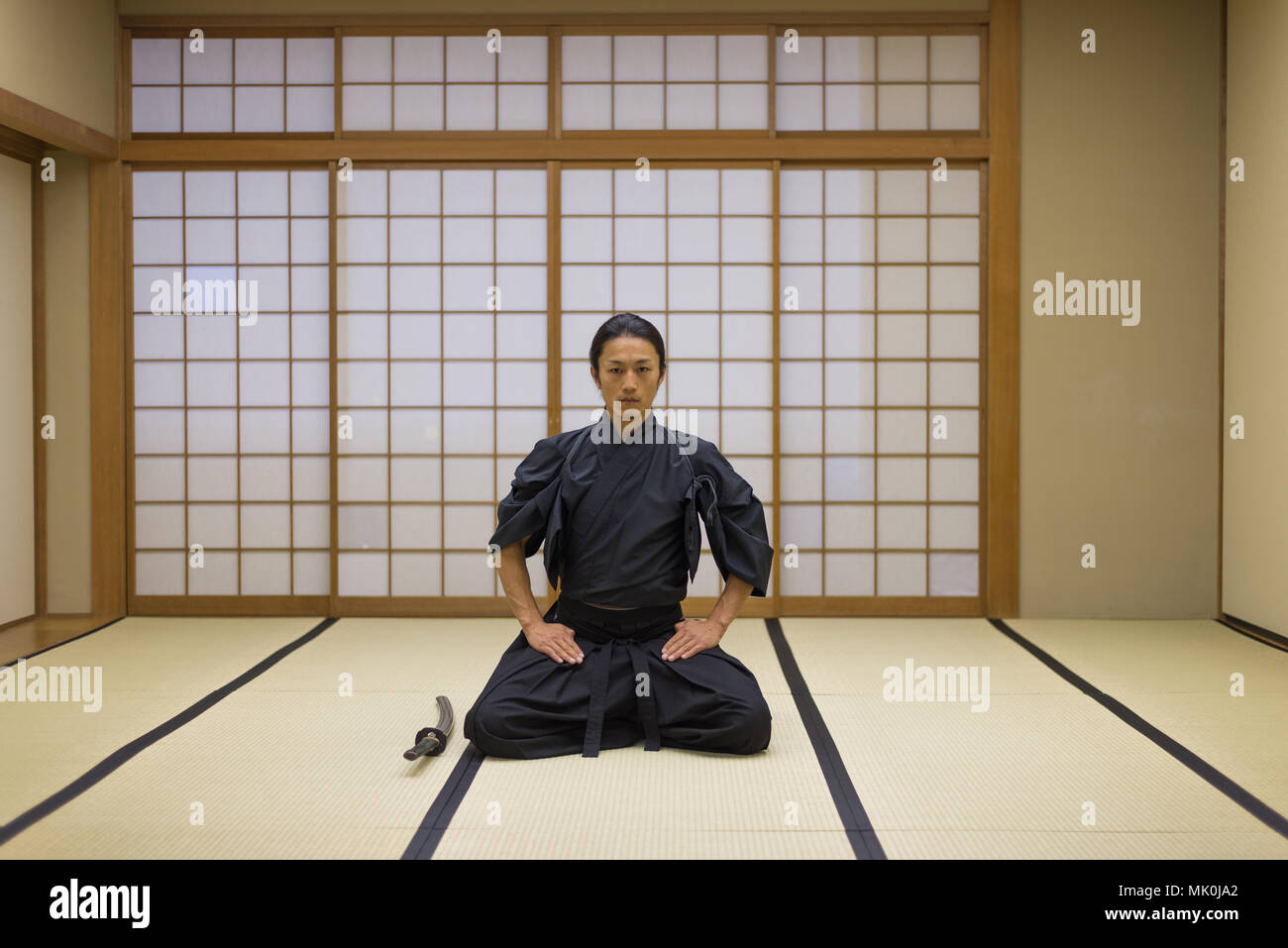 Japanese martial arts athlete training kendo in a dojo - Samaurai ...