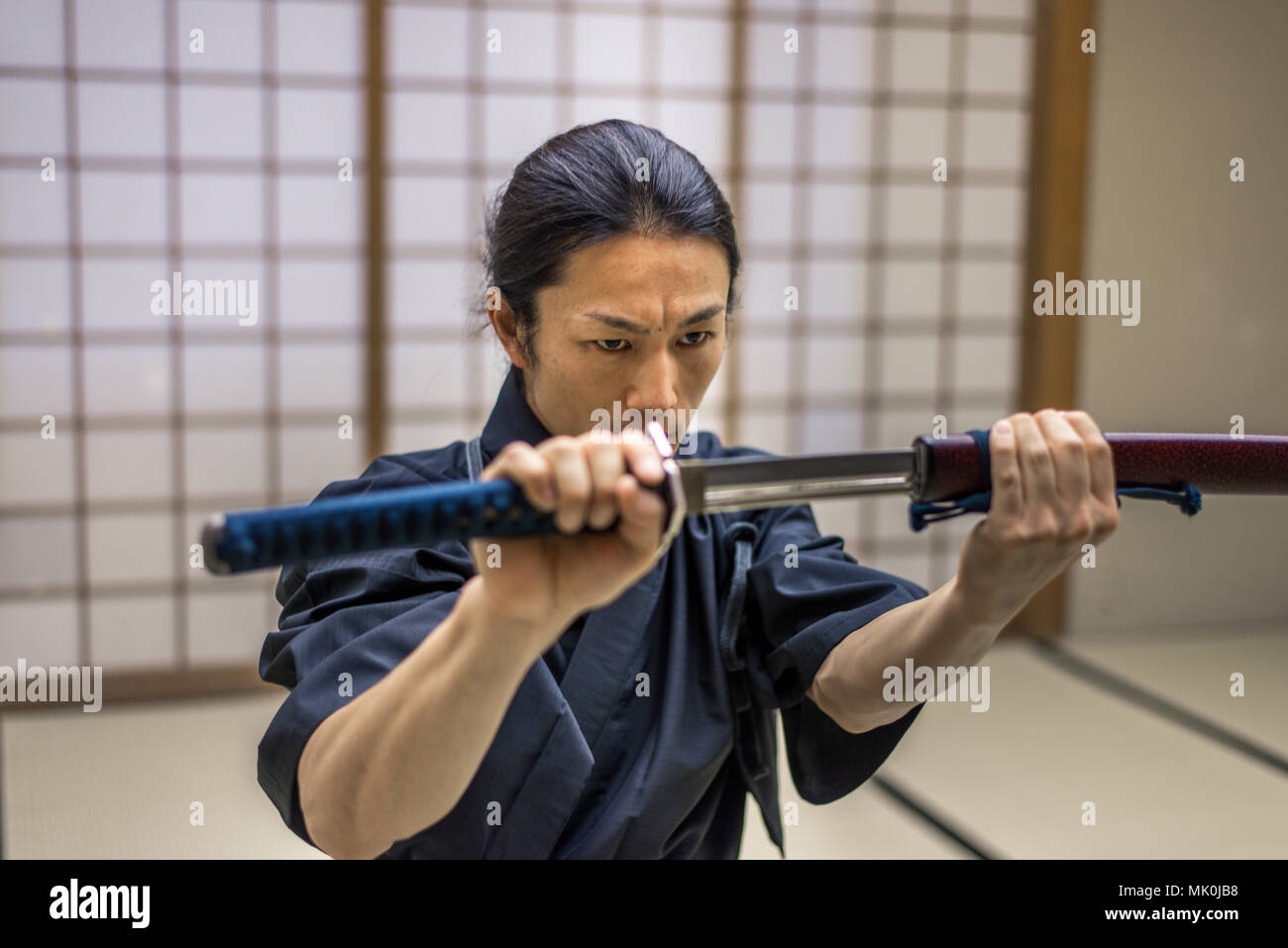 Japanese martial arts athlete training kendo in a dojo - Samaurai ...