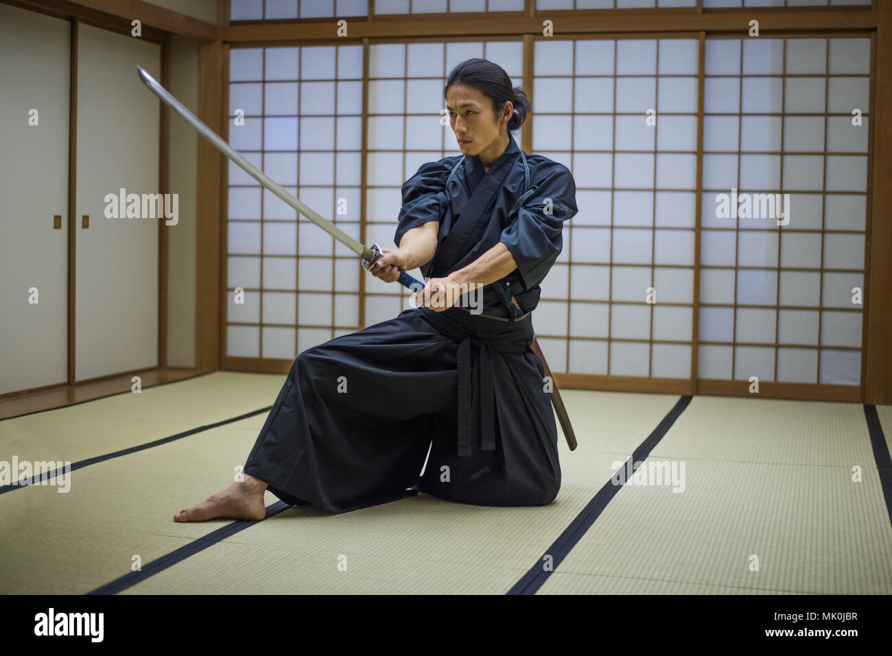 Japanese martial arts athlete training kendo in a dojo - Samaurai ...