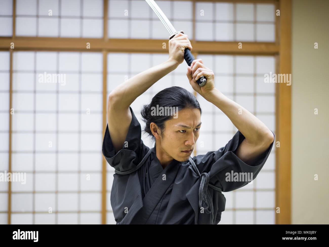 Japanese martial arts athlete training kendo in a dojo - Samaurai ...
