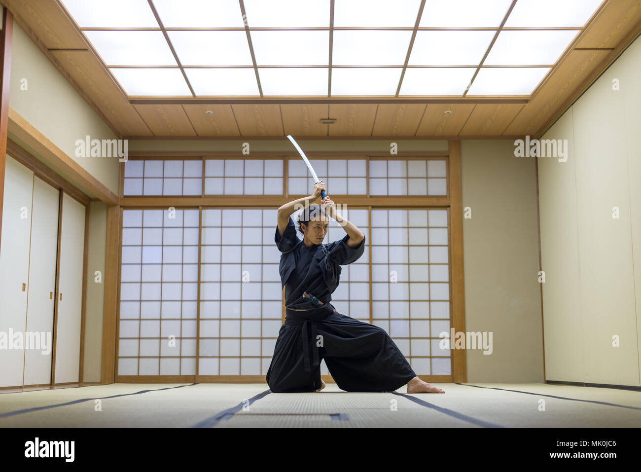 Japanese martial arts athlete training kendo in a dojo - Samaurai ...