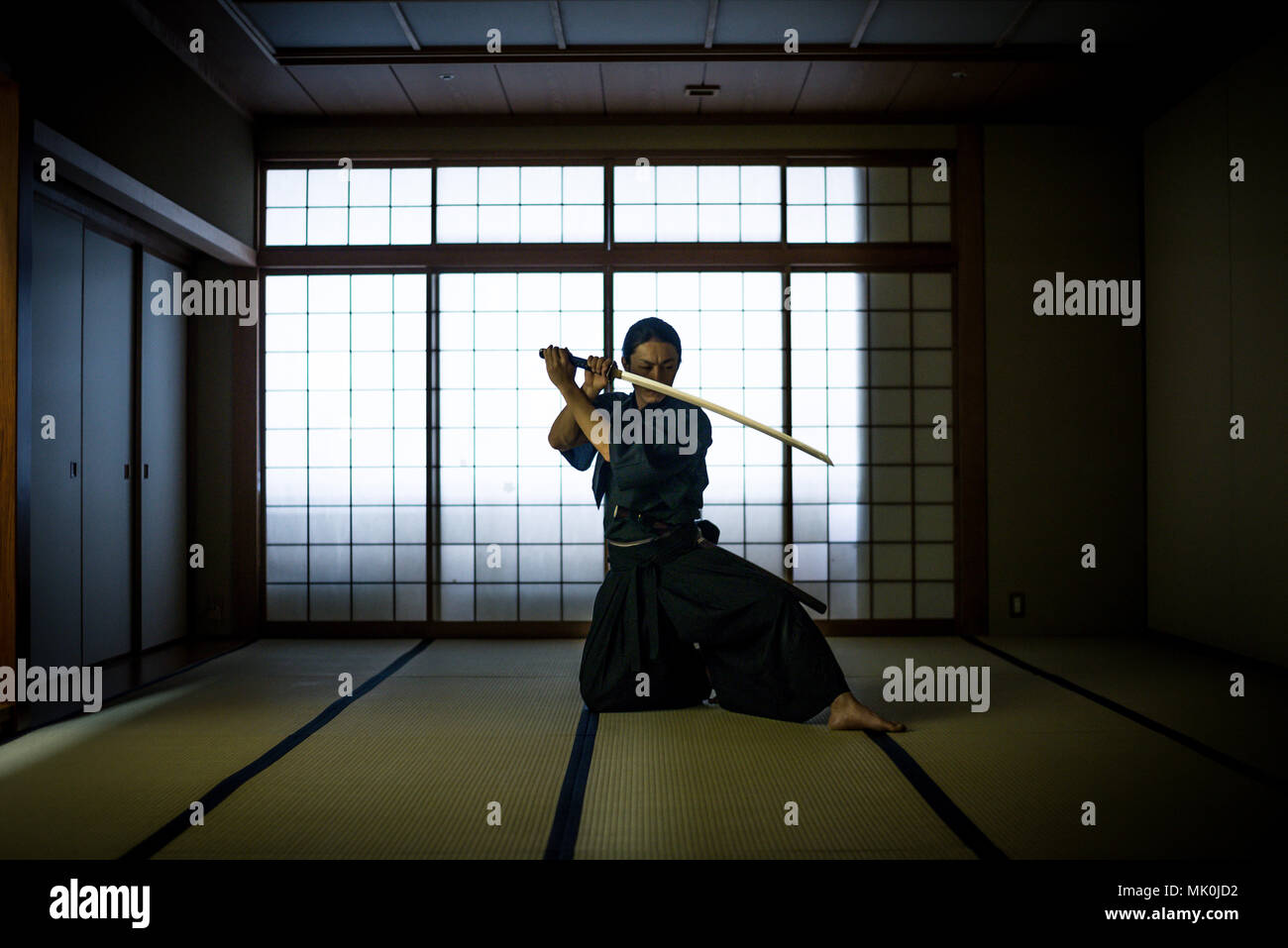 Japanese martial arts athlete training kendo in a dojo - Samaurai ...