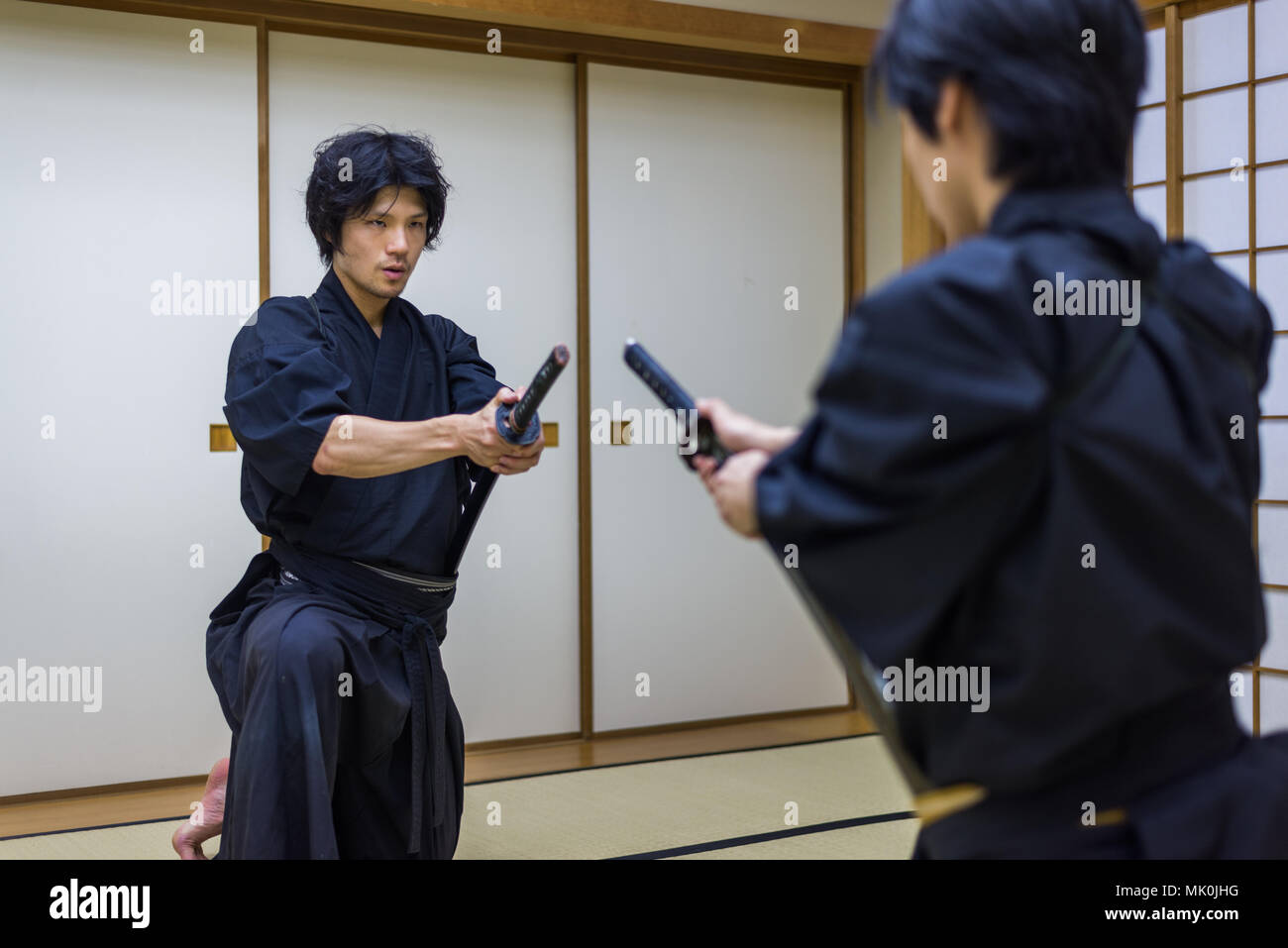 Japanese martial arts athlete training kendo in a dojo - Samaurai ...