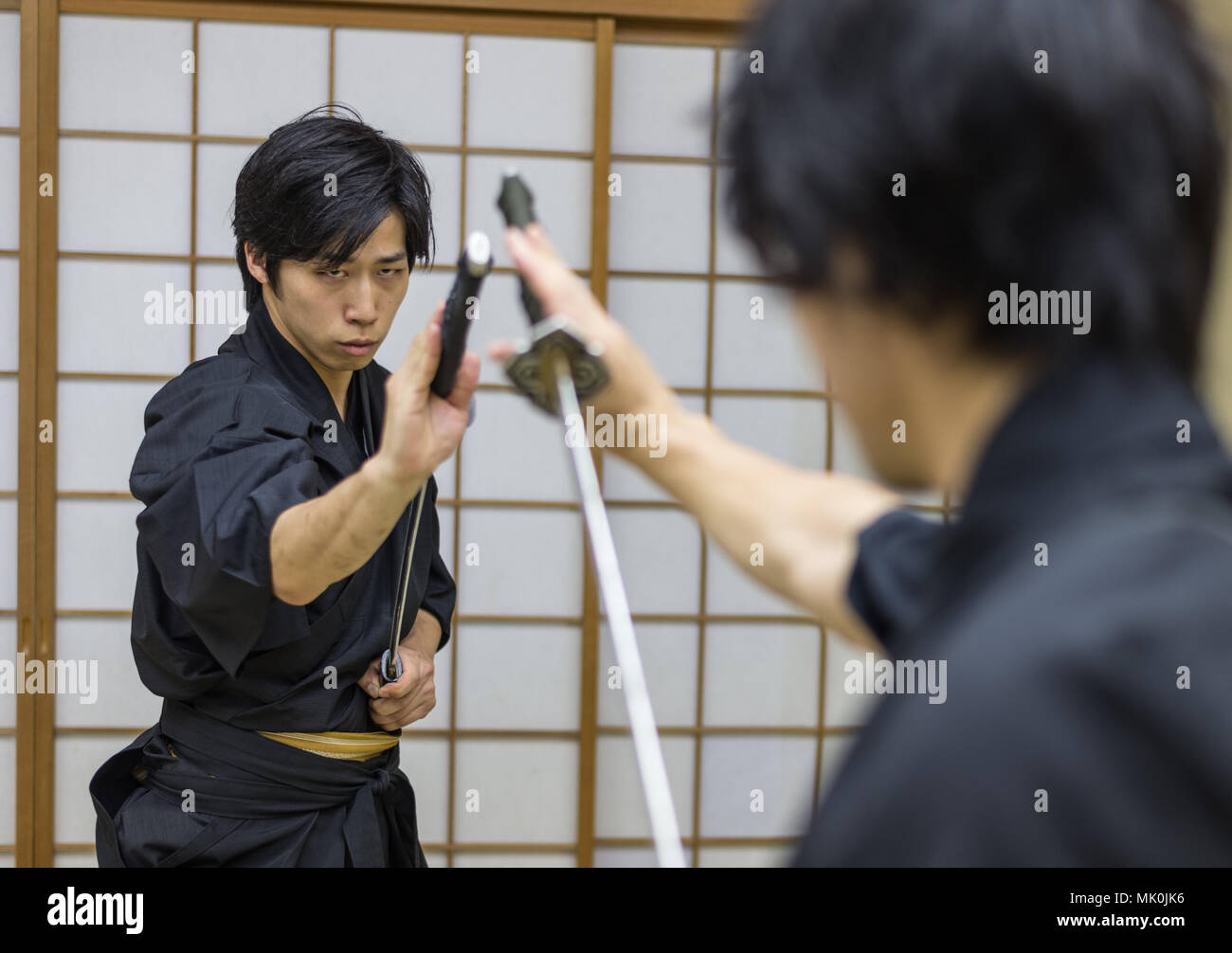 Japanese martial arts athlete training kendo in a dojo - Samaurai ...
