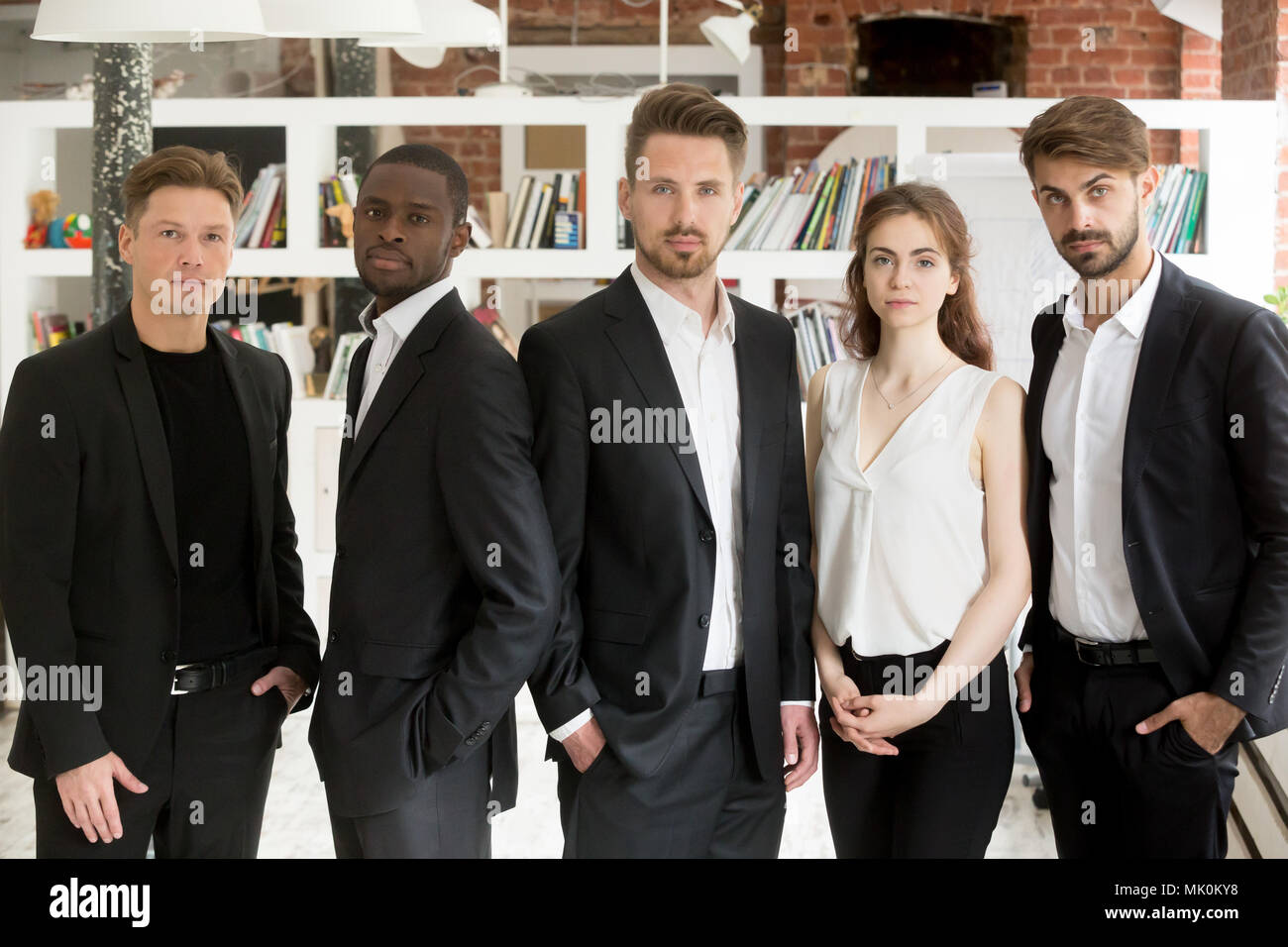 Team posing hi-res stock photography and images - Alamy