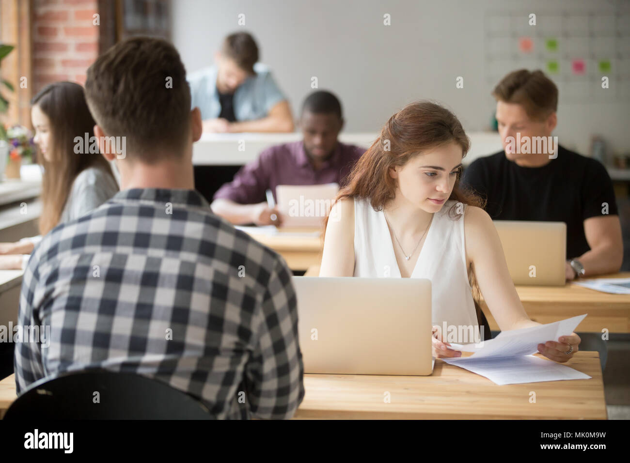 Girl reading report paper hi-res stock photography and images - Alamy