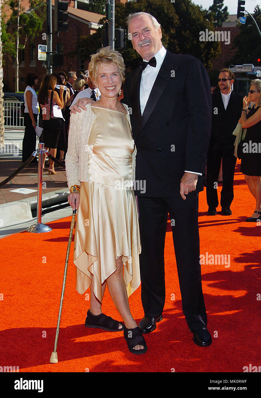 John Cleese and wife arriving at the 2004 Emmy Creative Arts Awards at ...