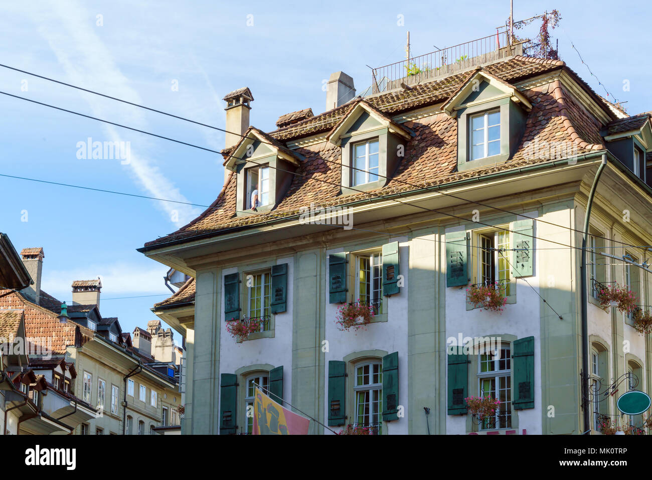 Traditional house in the old town and the flag of Bern, Switzerland ...