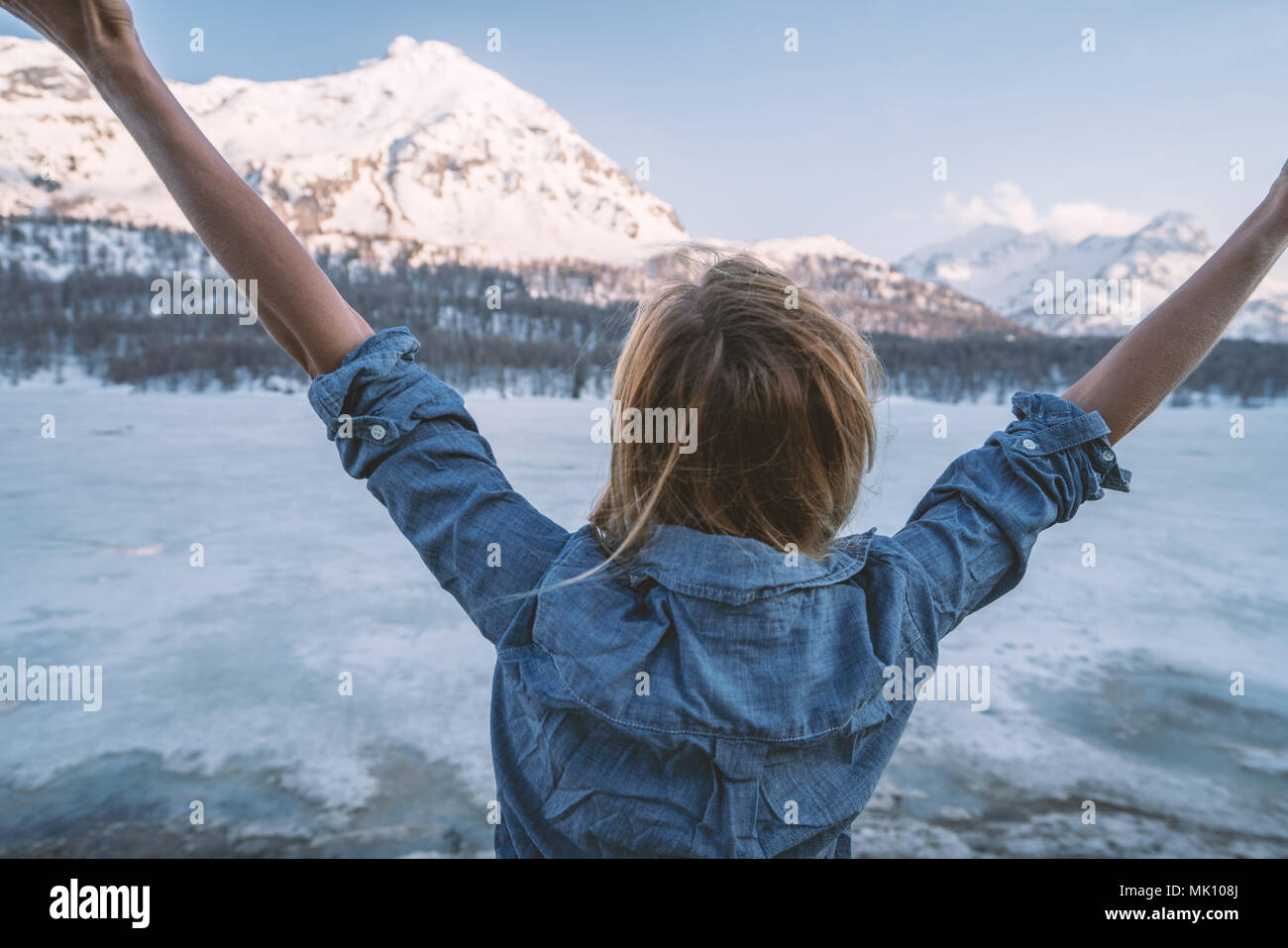 Young woman arms outstretched in nature, mountain landscape in ...