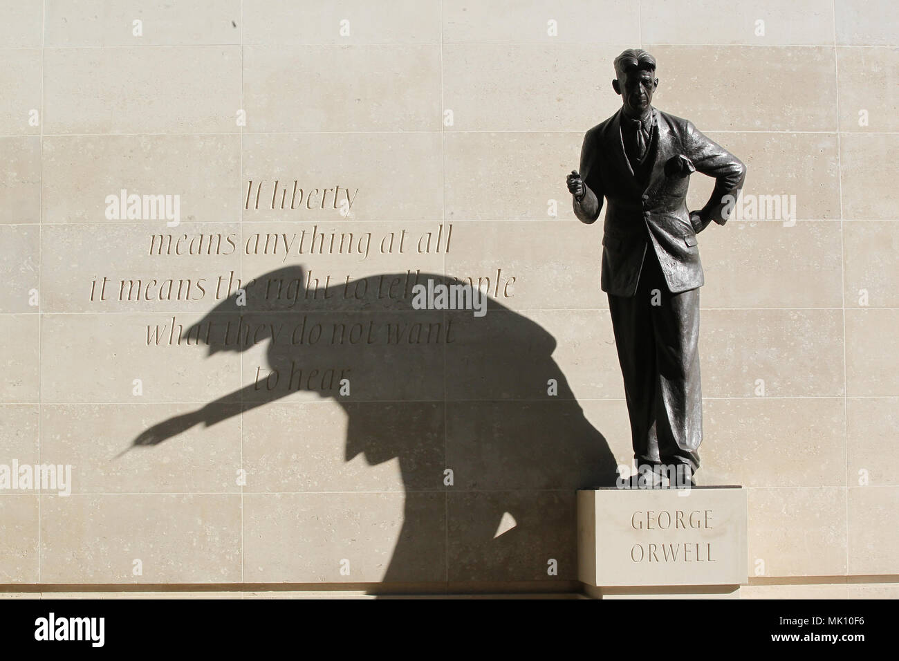 George Orwell statue casting a shadow in the bright sun outside BBC ...