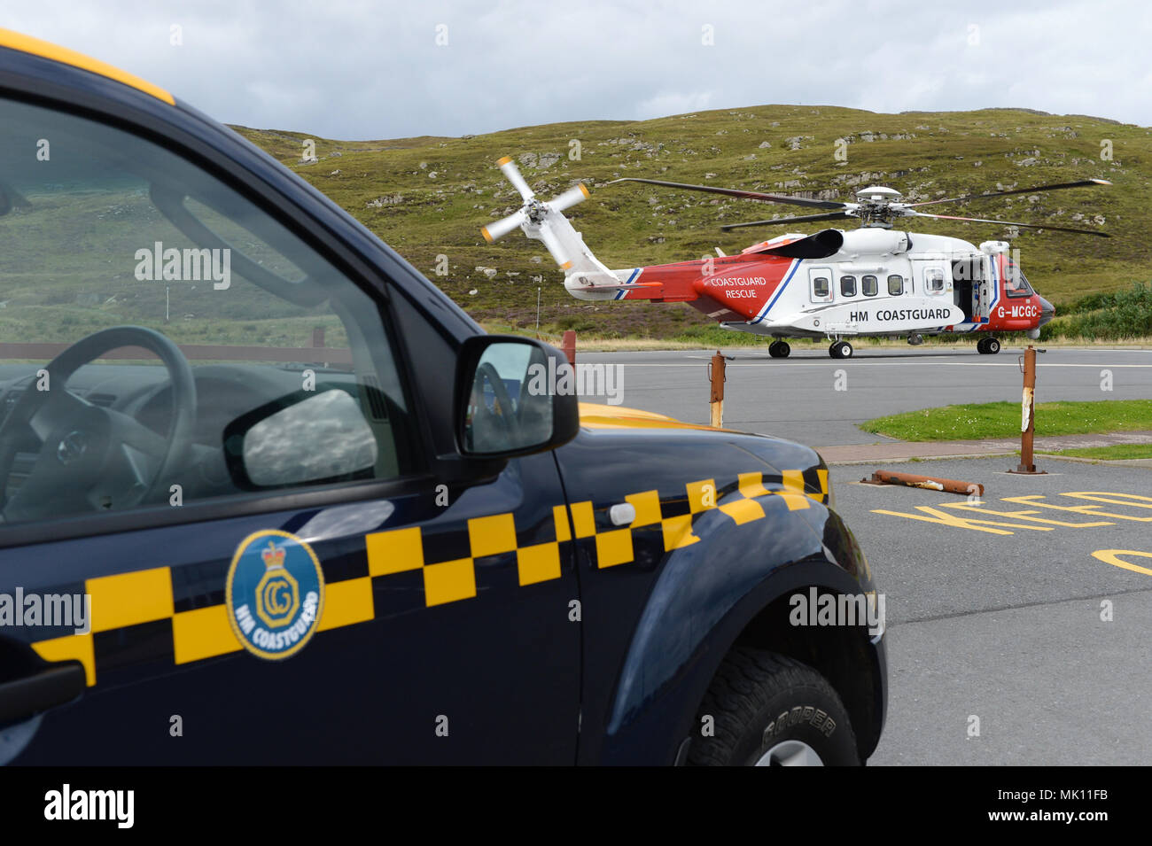 HM Coastguard pickup and helicopter at landing site Stock Photo - Alamy