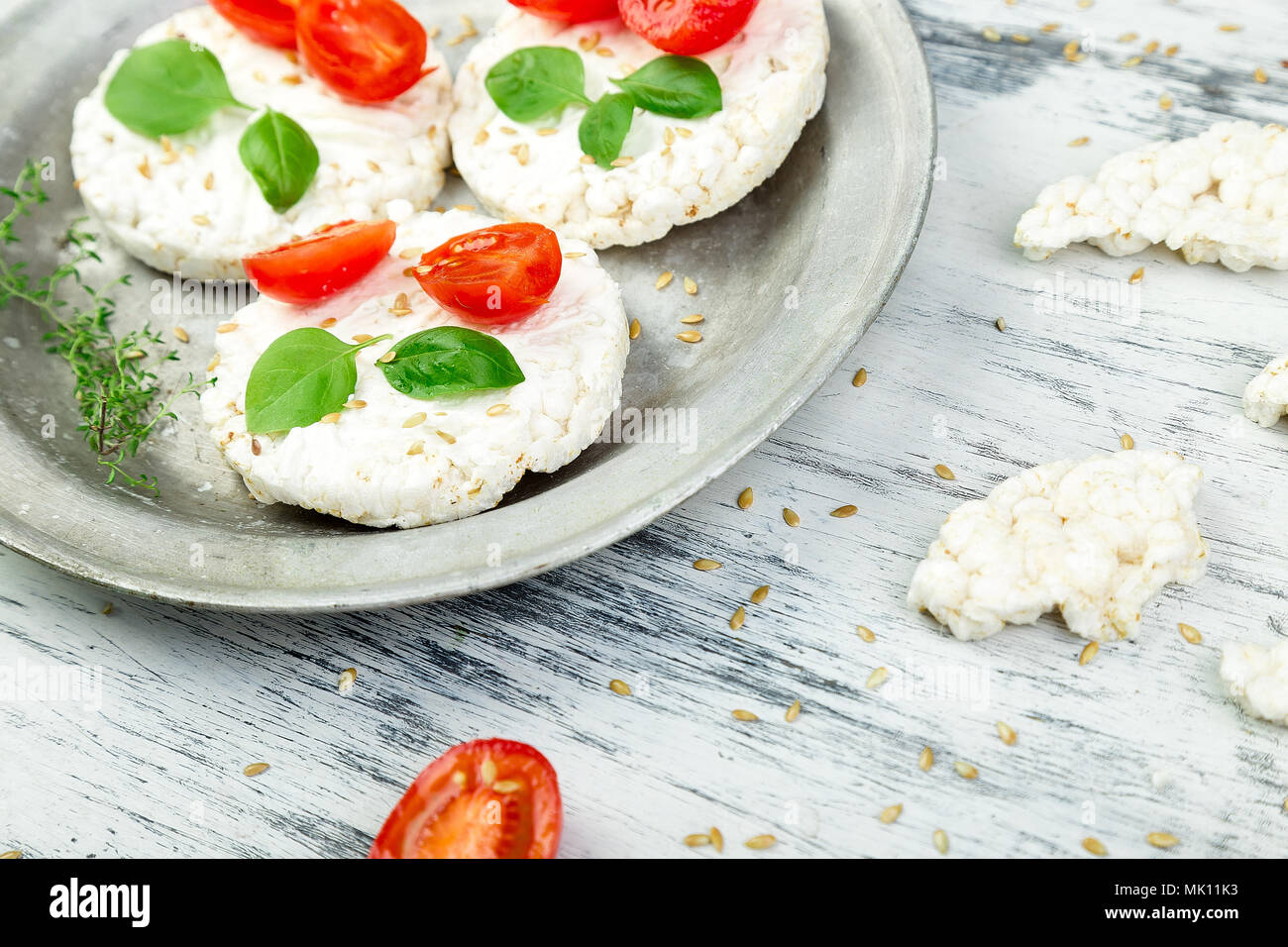 Healthy Rice Cakes with cherry tomatoes, cheese feta, basil and sesame ...