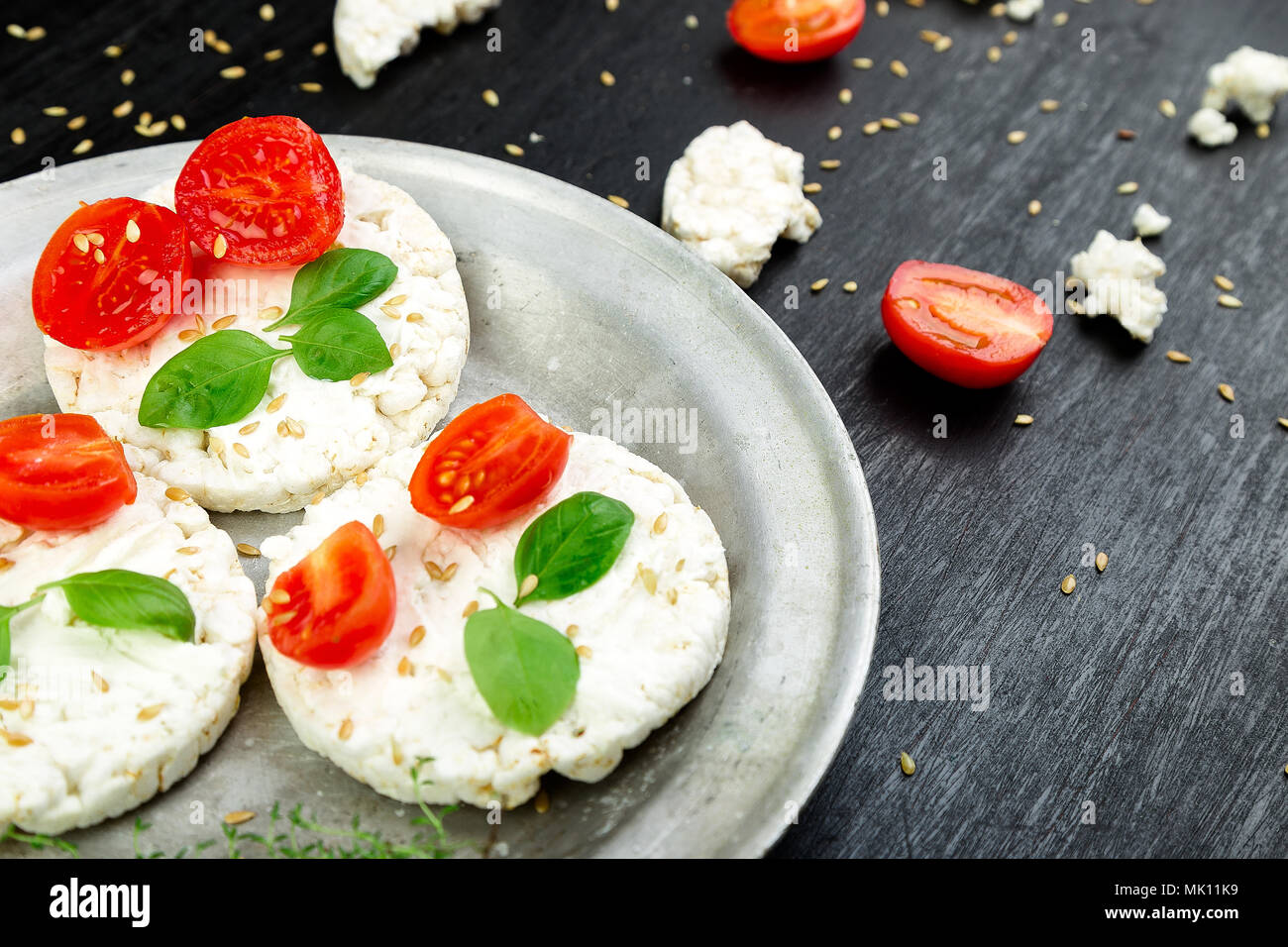 Healthy Rice Cakes with cherry tomatoes, cheese feta, basil and sesame ...