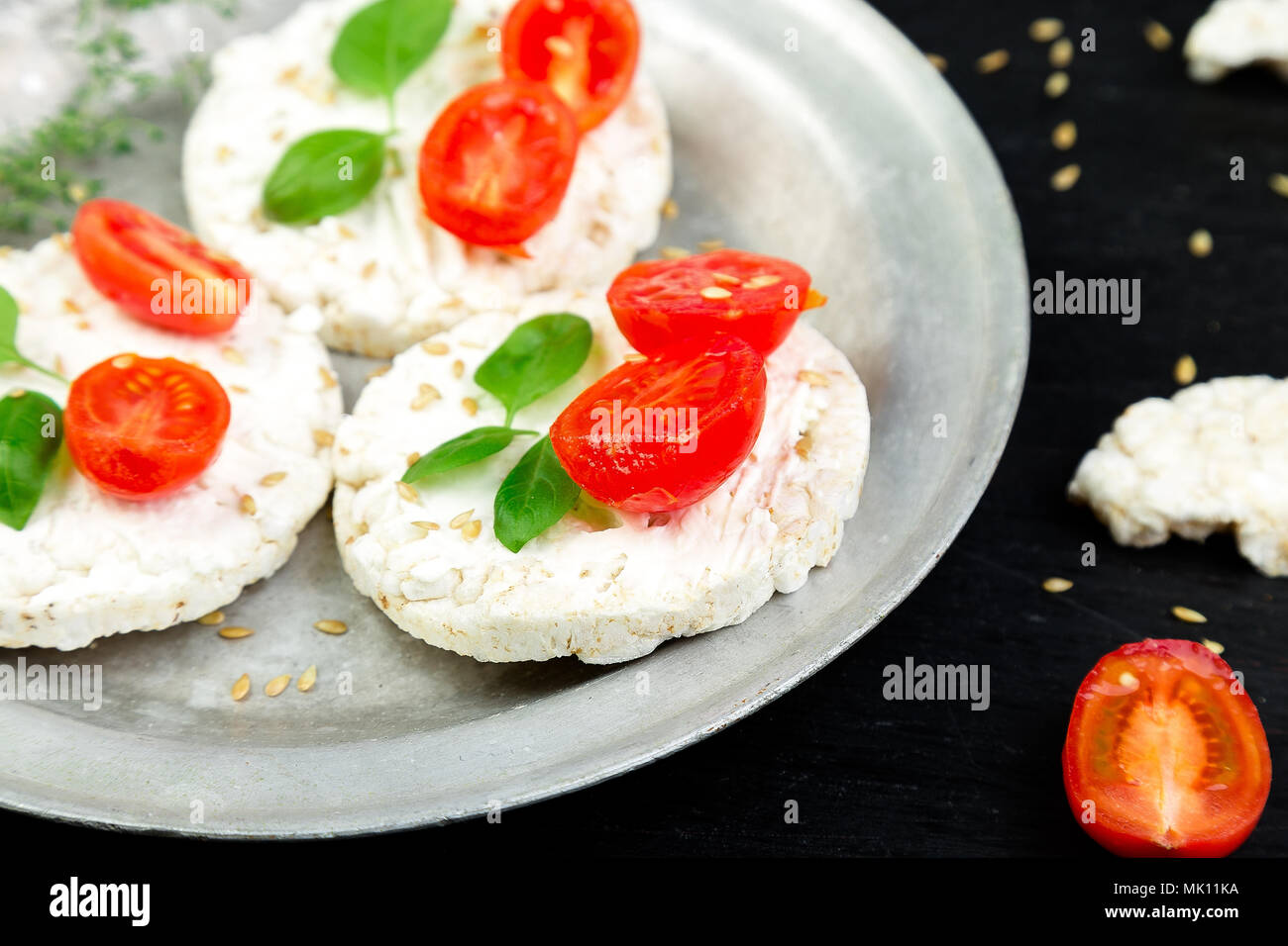 Healthy Rice Cakes with cherry tomatoes, cheese feta, basil and sesame ...