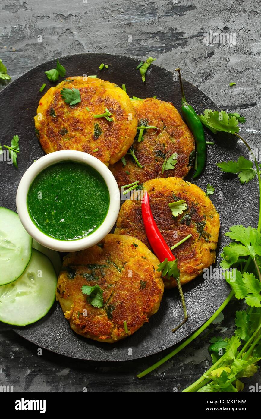 Aloo Tikki / Indian snack Potato Patties served with cilantro chutney ...