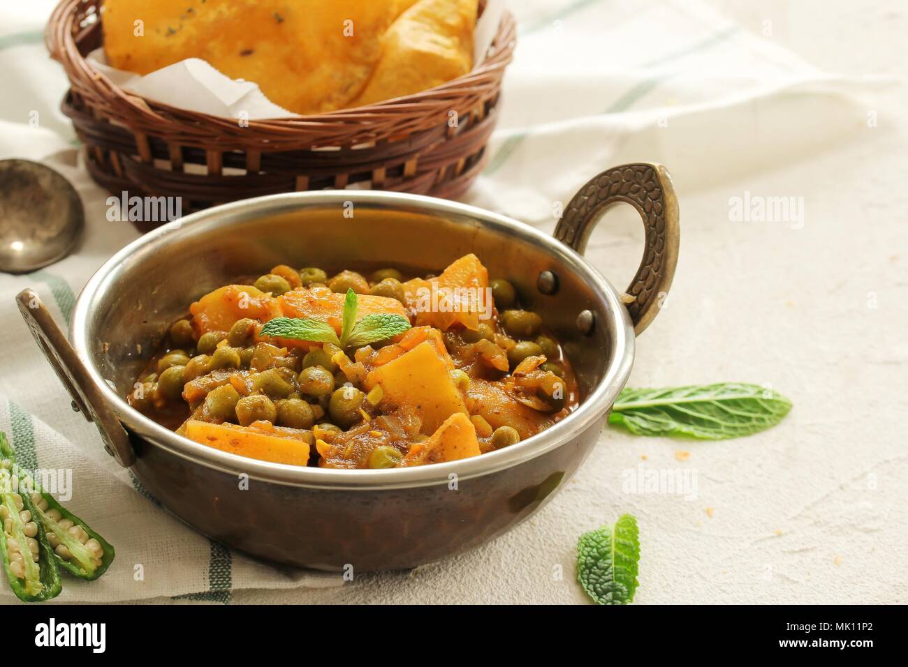 Alu Matar ( Aloo Mutter) served with Masala Puri or Poori / Indian ...