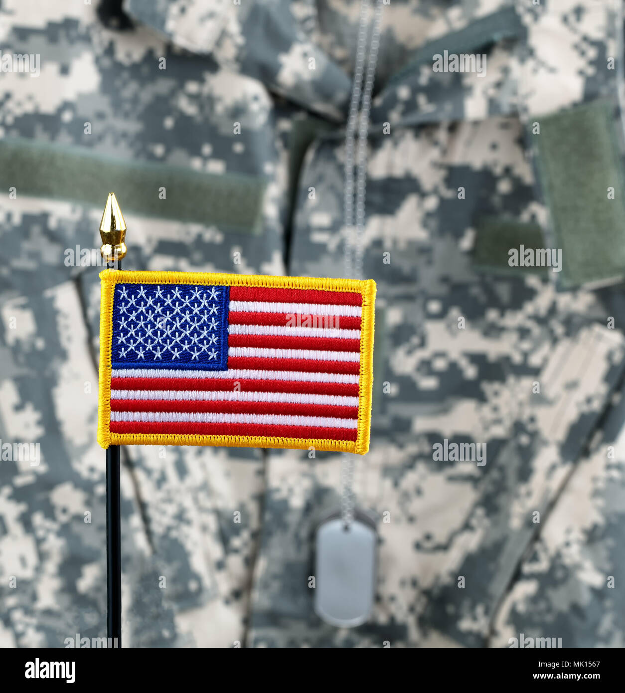 United States of America flag with camouflaged military uniform in ...