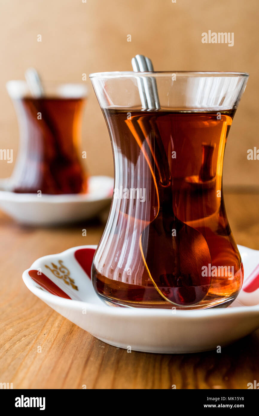 Traditional Turkish tea with spoon on wooden surface (turkish drink ...