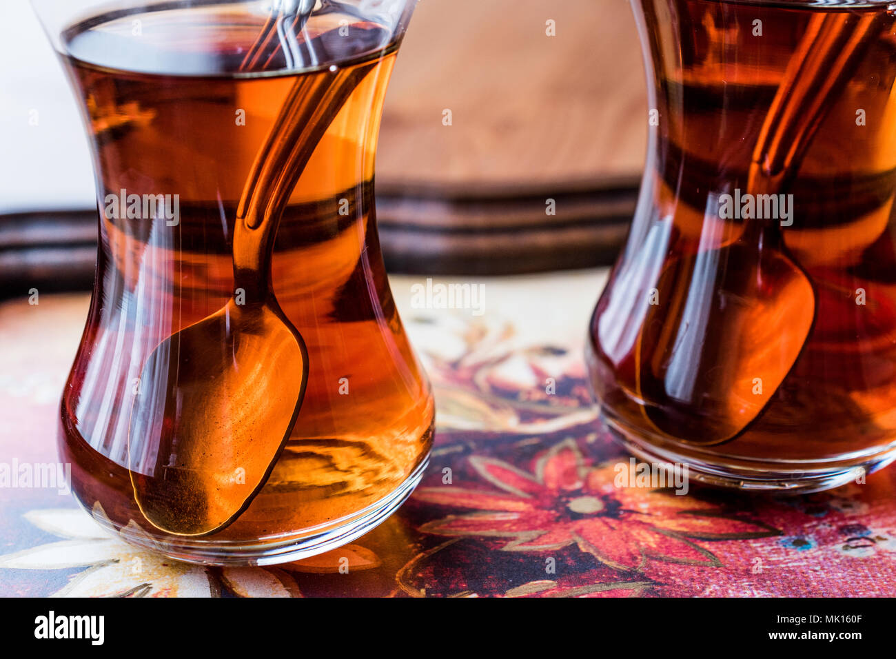 Traditional Turkish tea with spoon on wooden surface (turkish drink ...