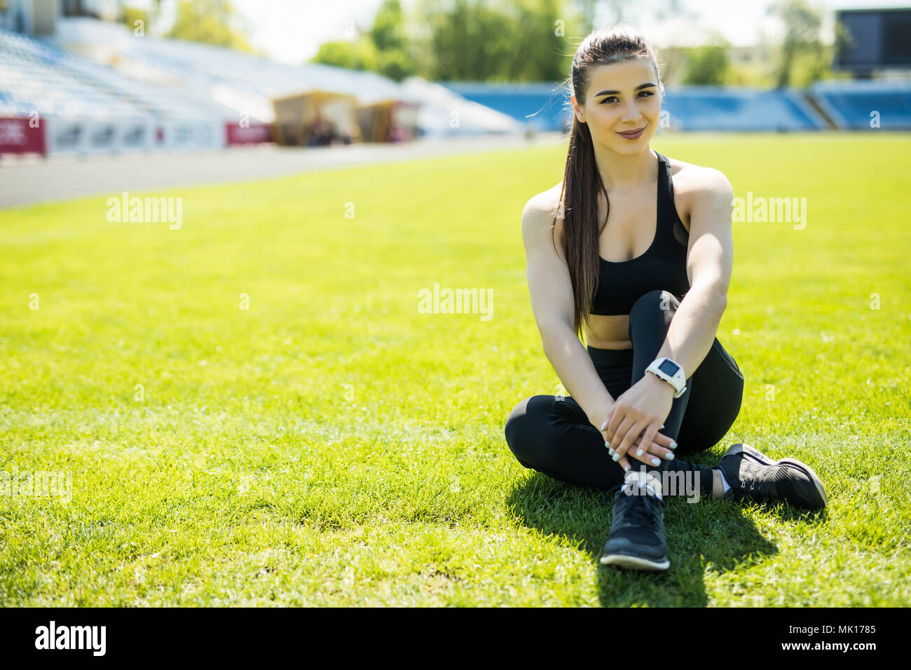 Young woman resting after exercising . Fitness beautiful girl . Female ...