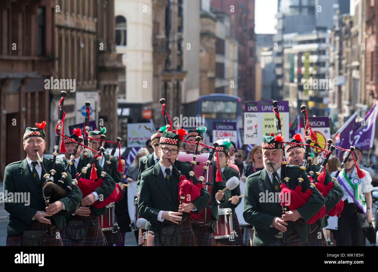 People take part in the annual May Day march in Glasgow during an ...