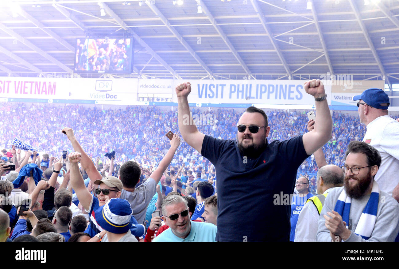 Cardiff City fans flood the pitch to celebrate their promotion to the ...