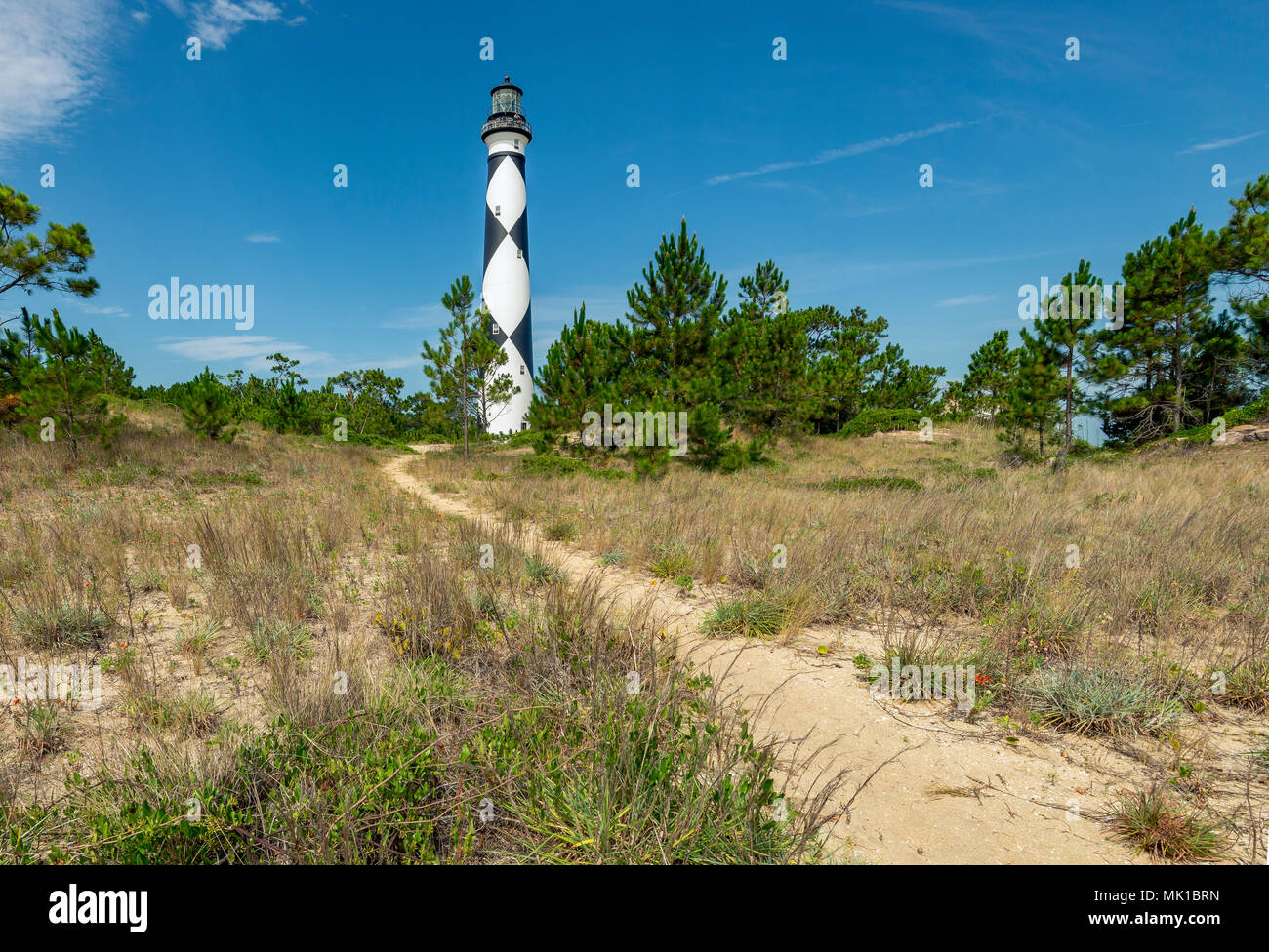 lighthouse beach scene on ocean shore beautiful landscape scene Stock ...