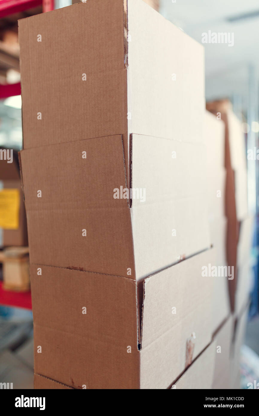 Photo of cardboard boxes in shop Stock Photo - Alamy