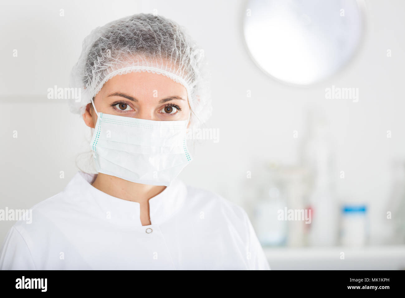 Young female nurse ready to receive patients in hospital Stock Photo ...