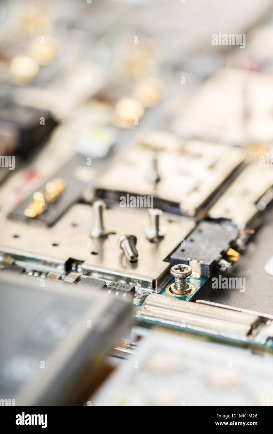 screw on background of the disassembled mobile phone Stock Photo - Alamy