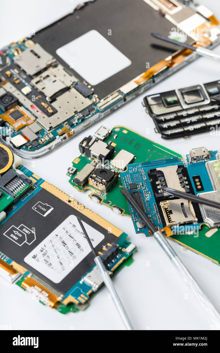 disassembled mobile phone and tools on white background Stock Photo - Alamy