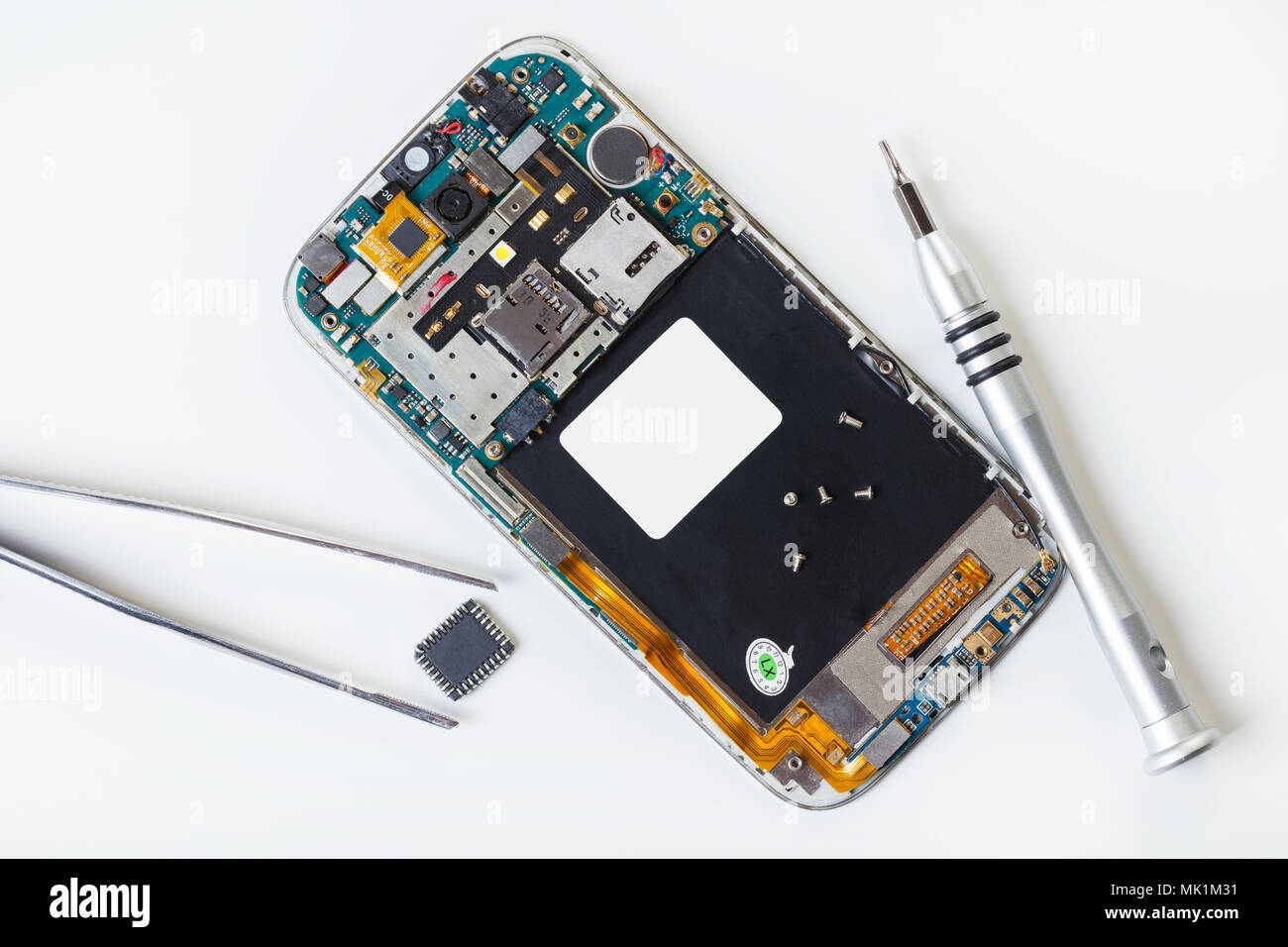 disassembled mobile phone and tools on white background Stock Photo - Alamy