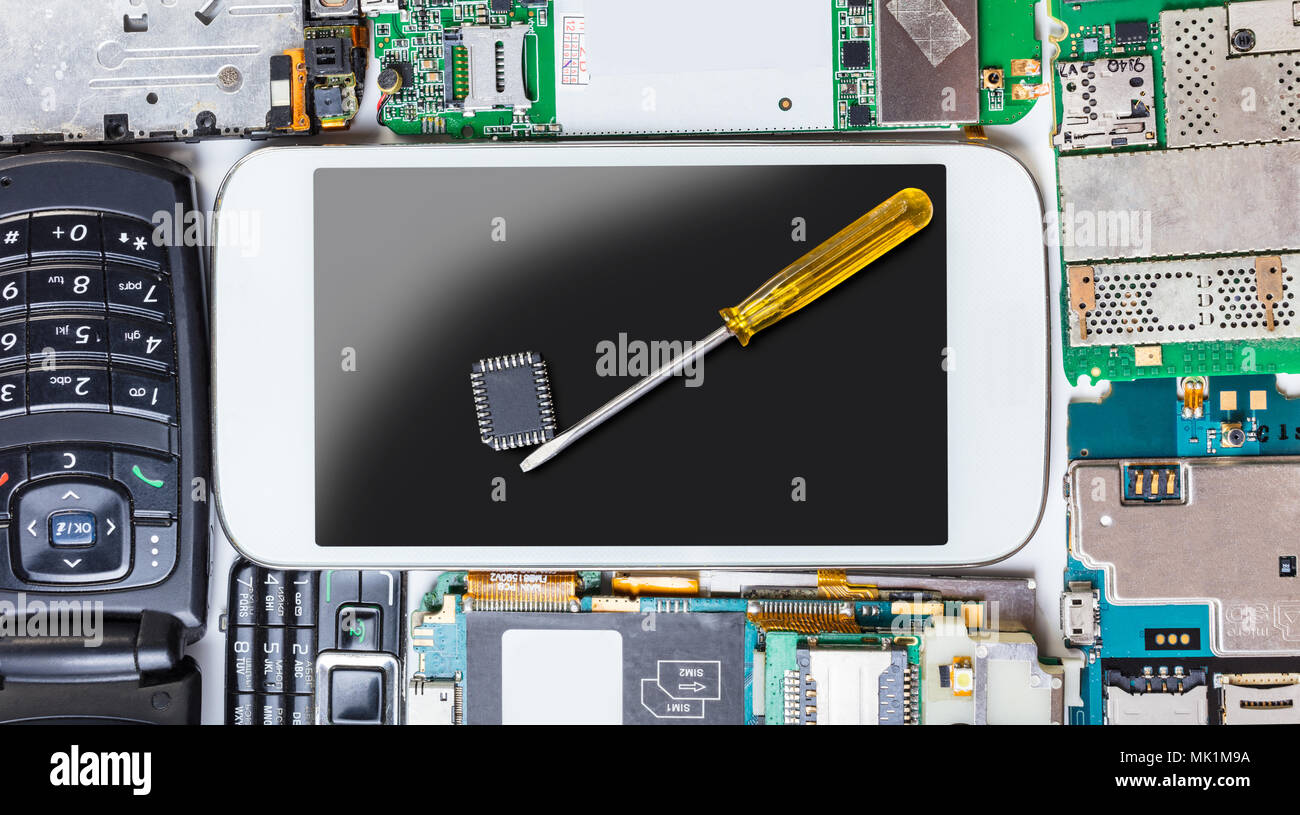 mobile phone with a tool on the background of electronic boards Stock ...