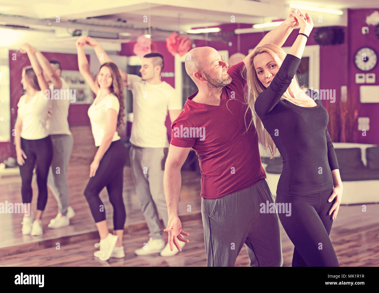 Dancing couples enjoying salsa hi-res stock photography and images - Alamy