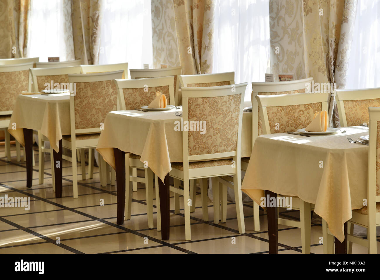 interior of restaurant in yellow tones Stock Photo - Alamy