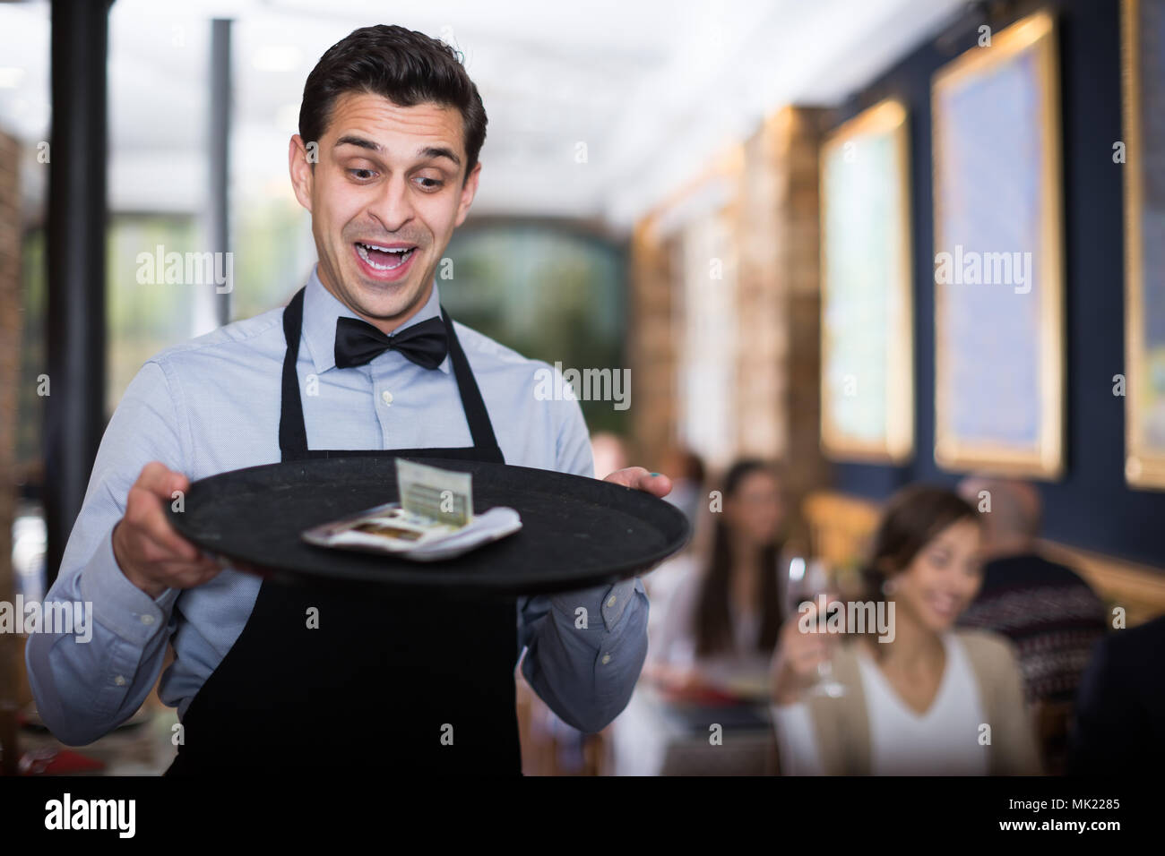 Professional waiter holding serving tray in restaurant with tips Stock ...