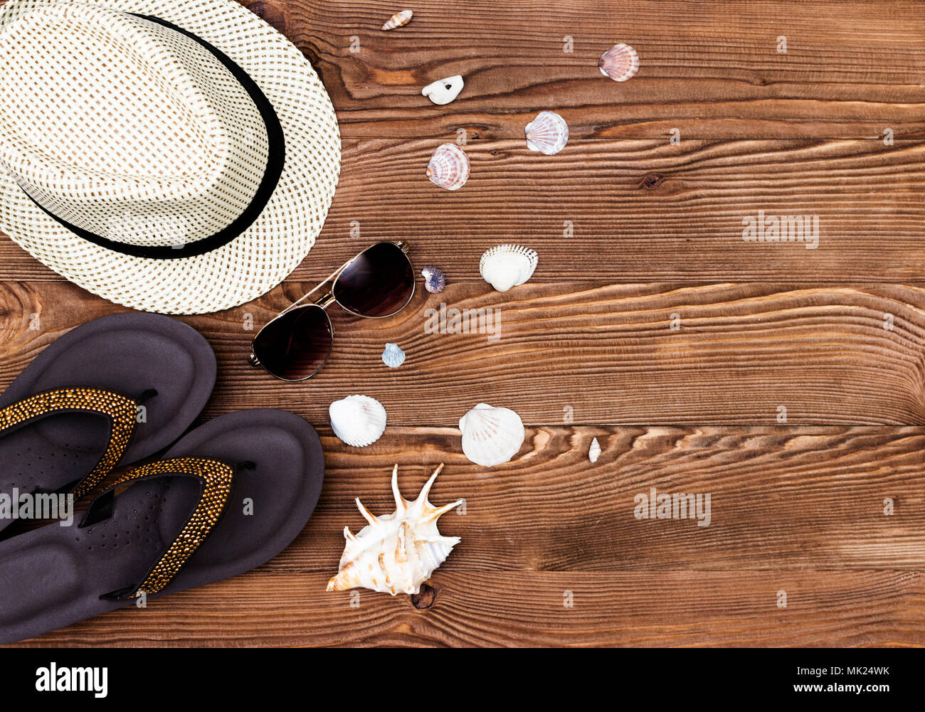 Beach and vacation items on wooden table. Top view with copy space ...