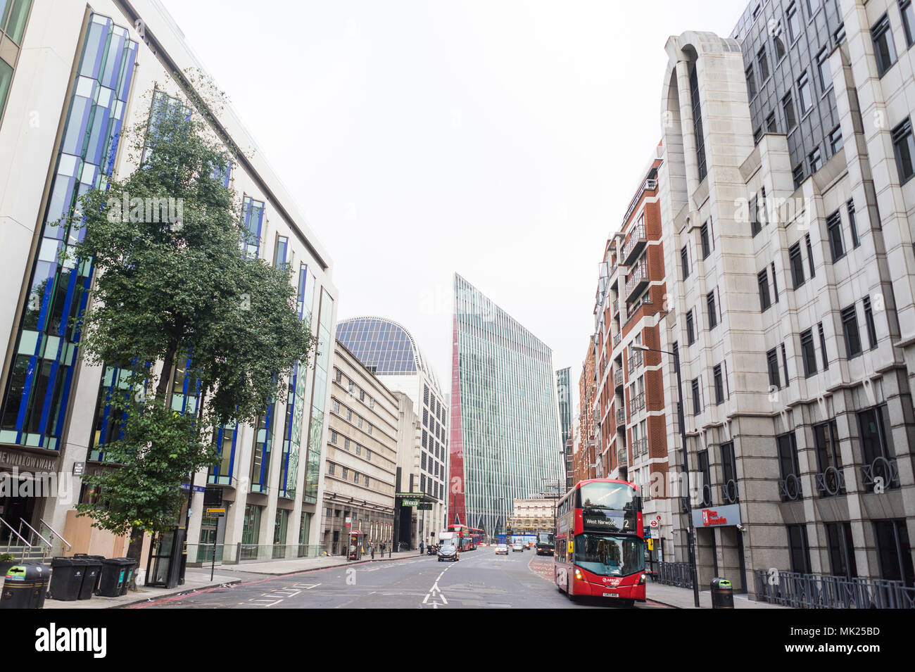 View of a street, buildings and typical red bus in London, England ...