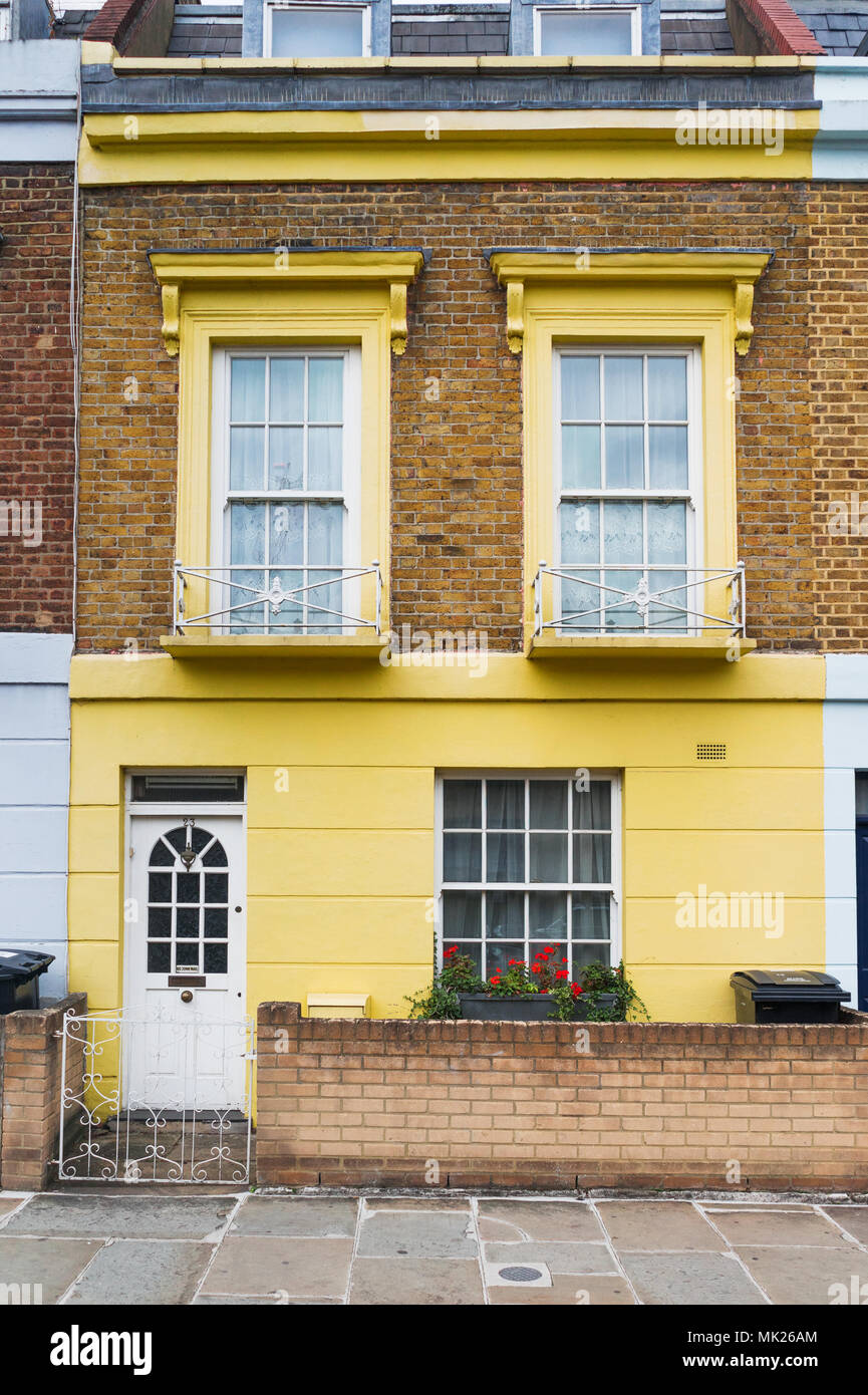 Yellow colored traditional English house in London, England, Europe ...