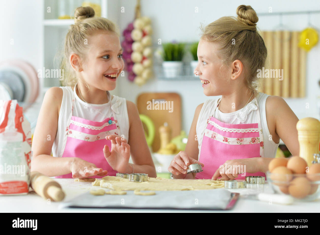 Two sisters in the kitchen Stock Photo - Alamy