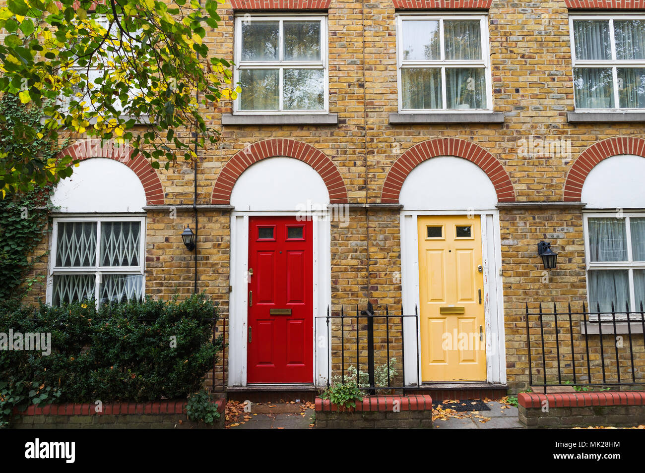 London house traditional brick wall facade and doors, UK, Europe Stock ...